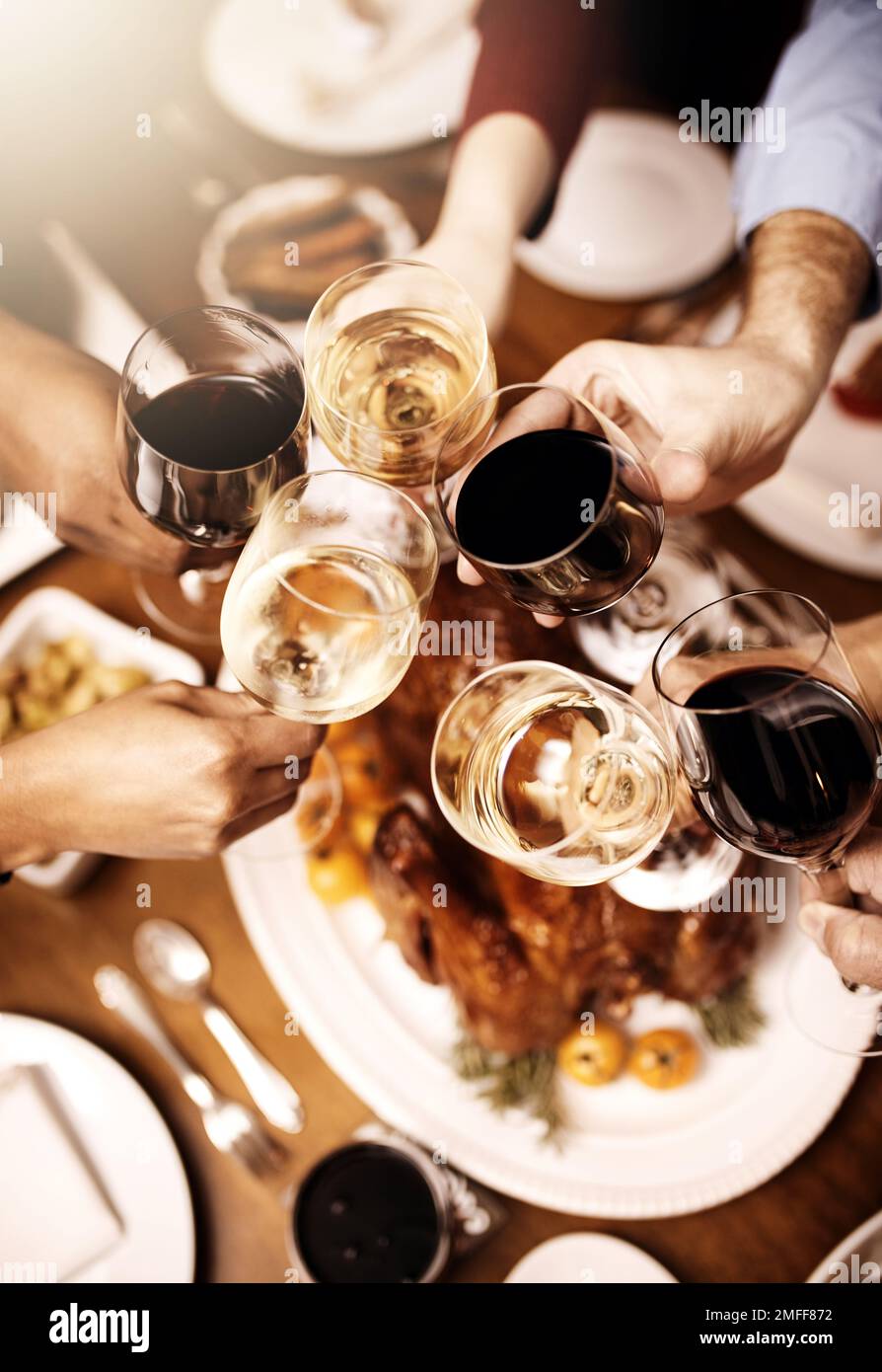 Merry Christmas everyone. a group of people making a toast over ...