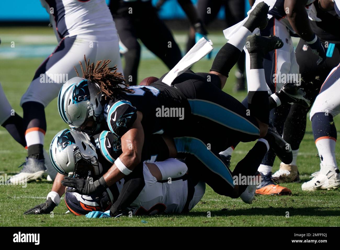 Denver Broncos quarterback Drew Lock is sacked by Carolina Panthers ...