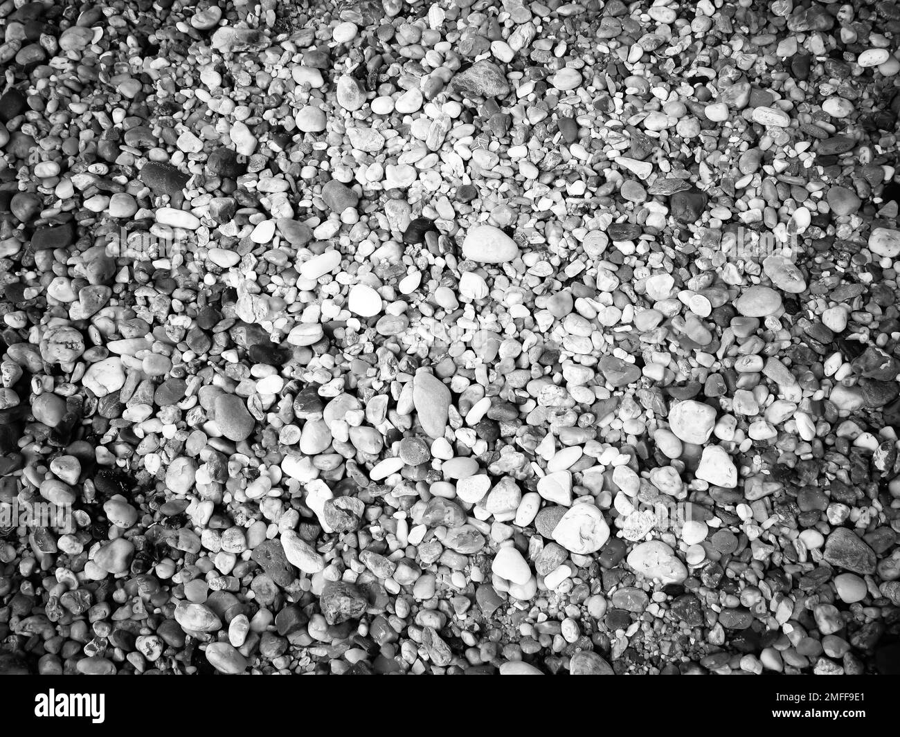 river bottom gravel and pebbles stone black white background Stock ...