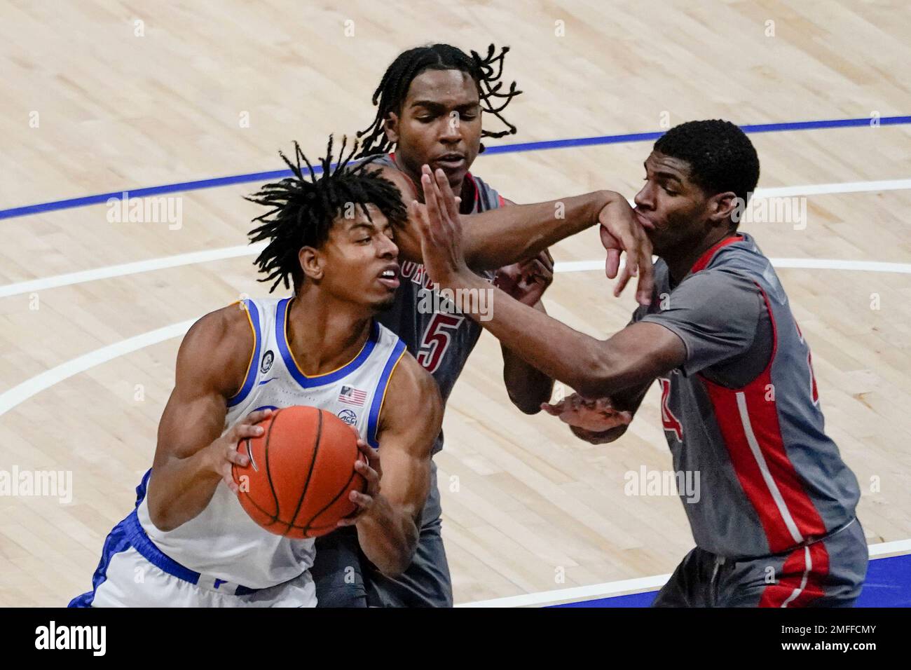 Pittsburgh's Noah Collier, left, tries to drive on Gardner Webb's ...