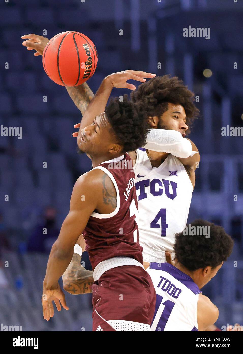 Texas A&M guard Quenton Jackson (3), and TCU guards PJ Fuller (4) and ...