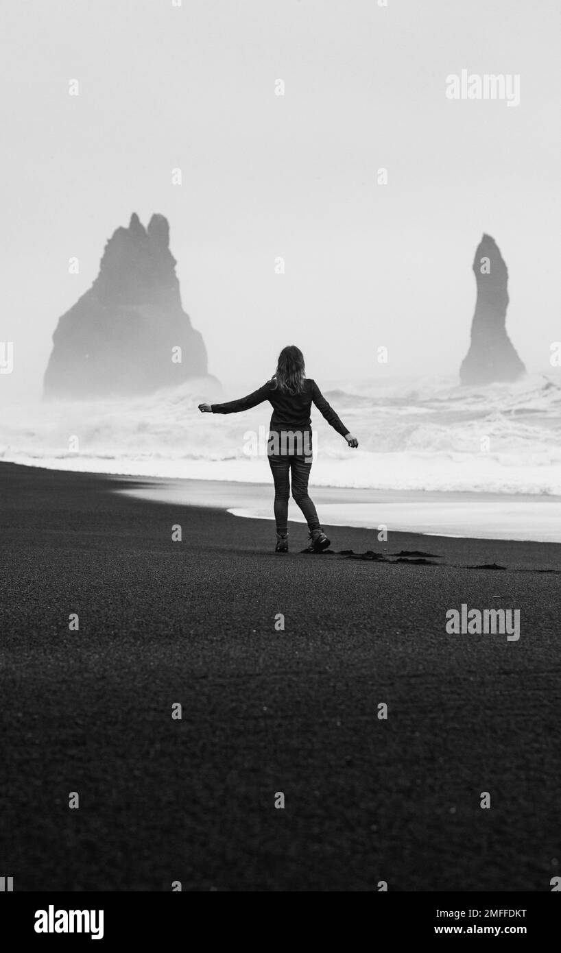 Inspired tourist looking at rock columns monochrome scenic photography ...