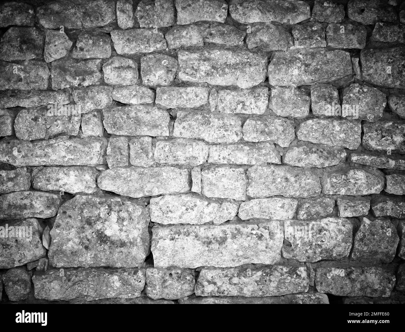 grey closeup of granite stone wall background texture black white color ...