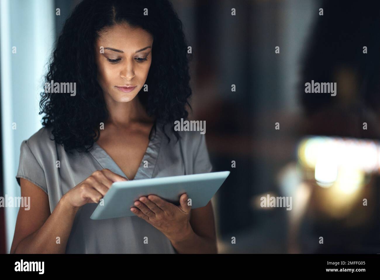 Productivity at her fingertips. a young businesswoman using a digital ...