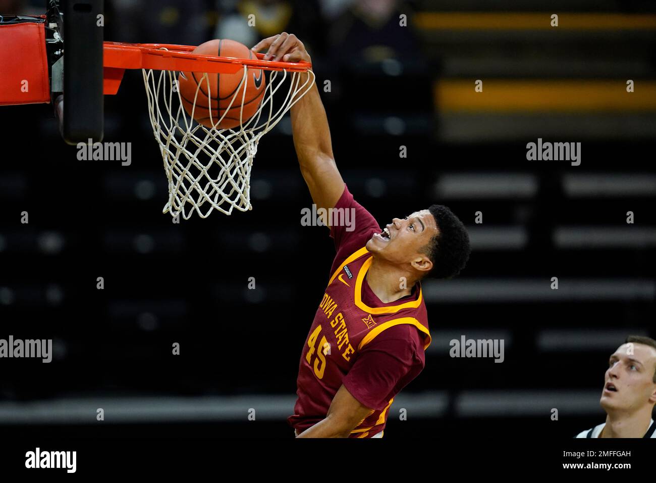 Iowa State guard Rasir Bolton (45) dunks the ball ahead of Iowa forward ...