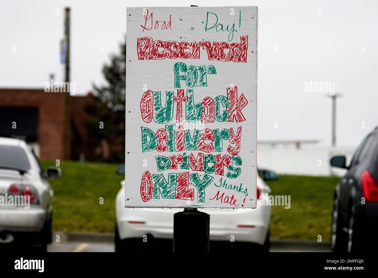 A delivery drivers only sign is posted at a restaurant parking lots in ...