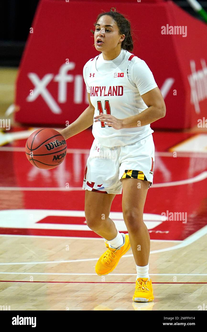 Maryland guard Katie Benzan works the floor against against Towson ...