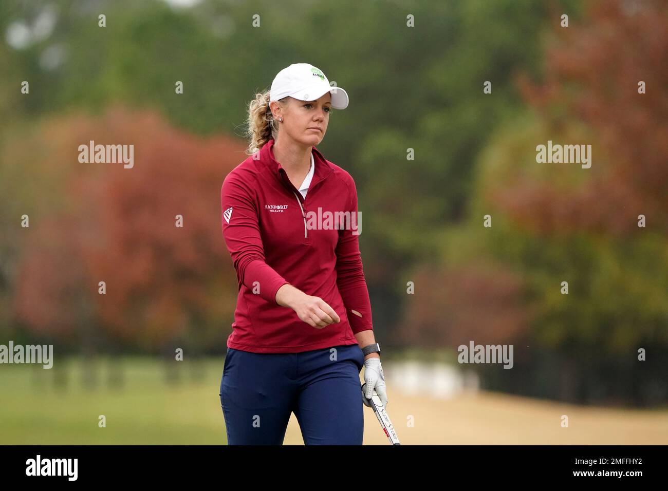 Amy Olson watches per putt on the first green during the second round ...