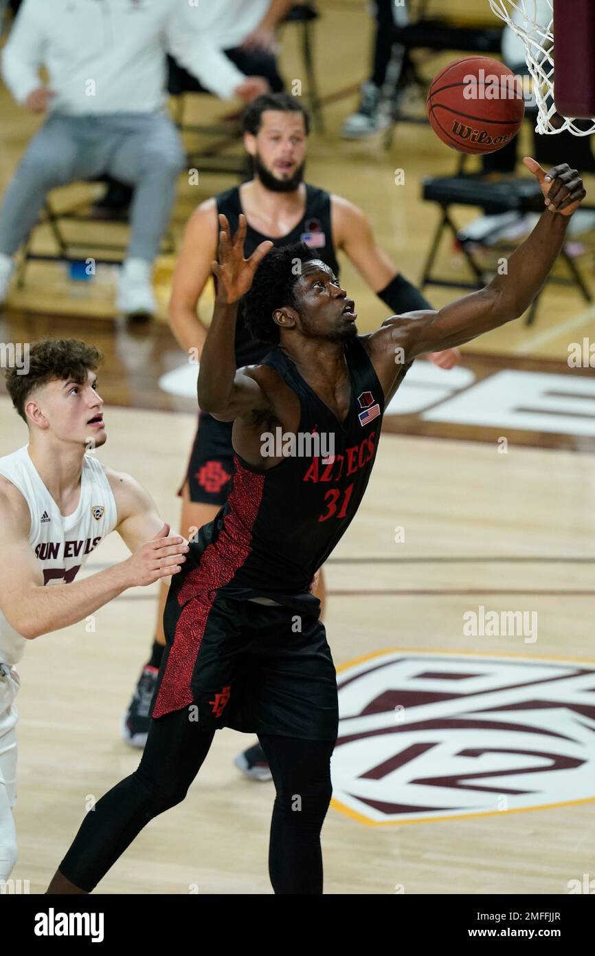 San Diego State forward Nathan Mensah (31) reaches for a rebound ...