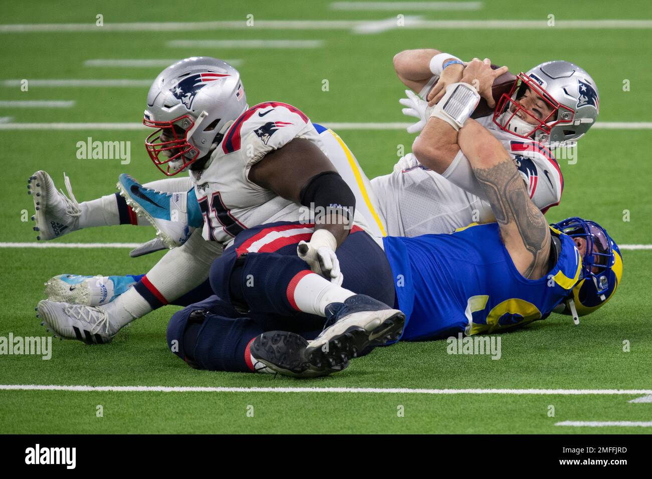 Los Angeles Rams defensive end Morgan Fox (97), bottom, sacks New ...