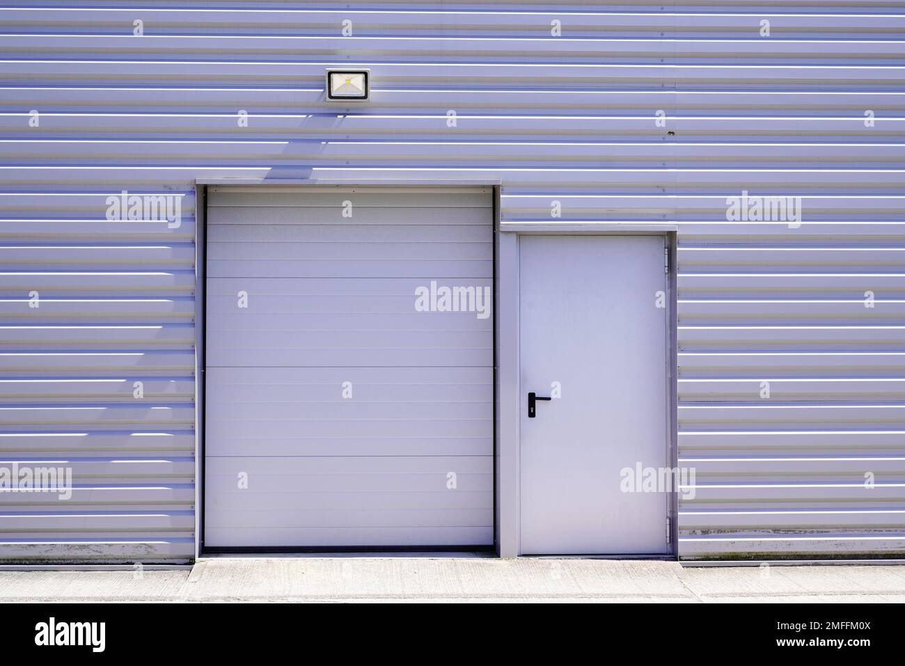 entrance roll-down shutters on gray building fire exit door in ...