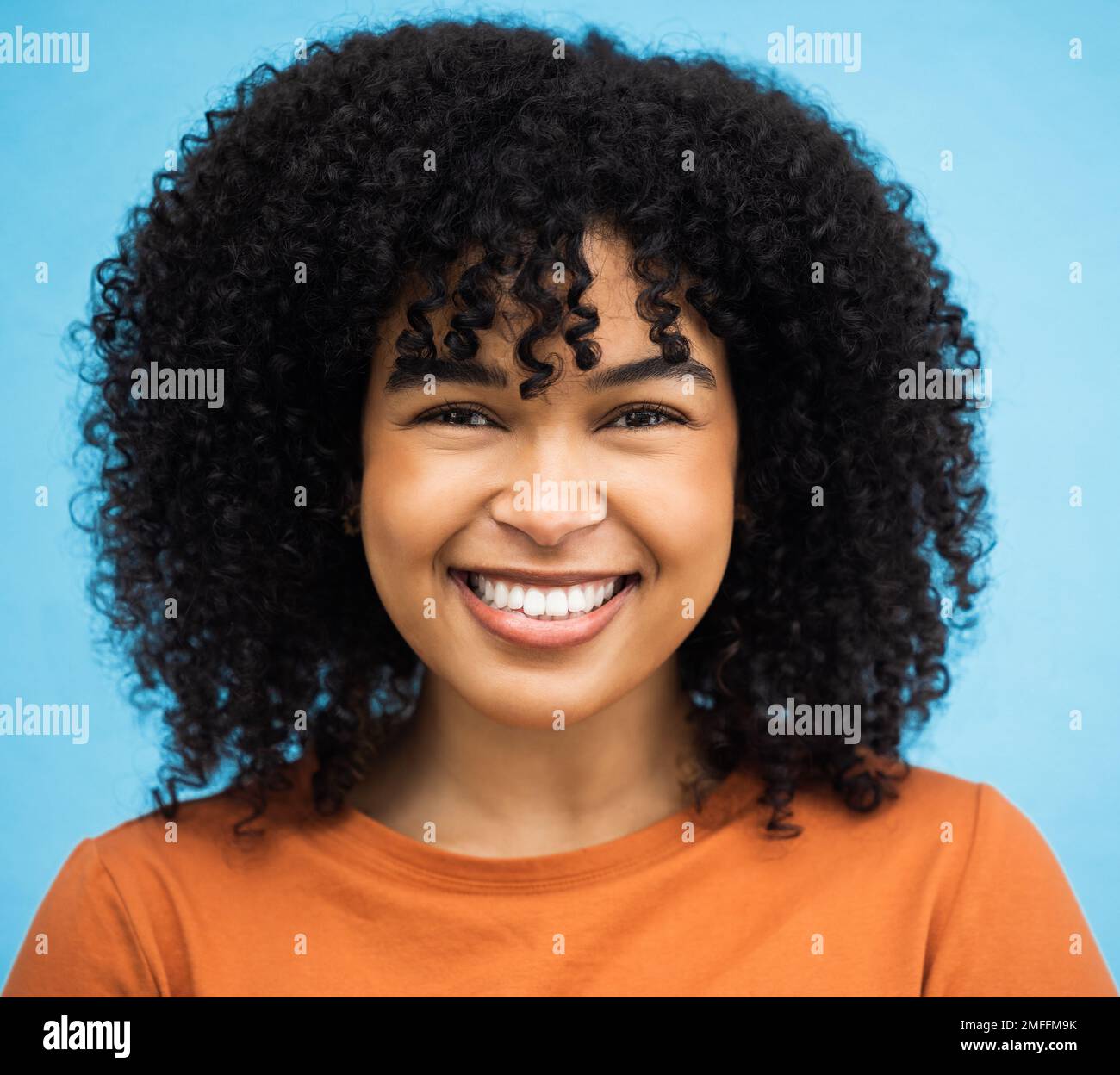 Happy, black woman or afro hairstyle portrait on isolated blue ...