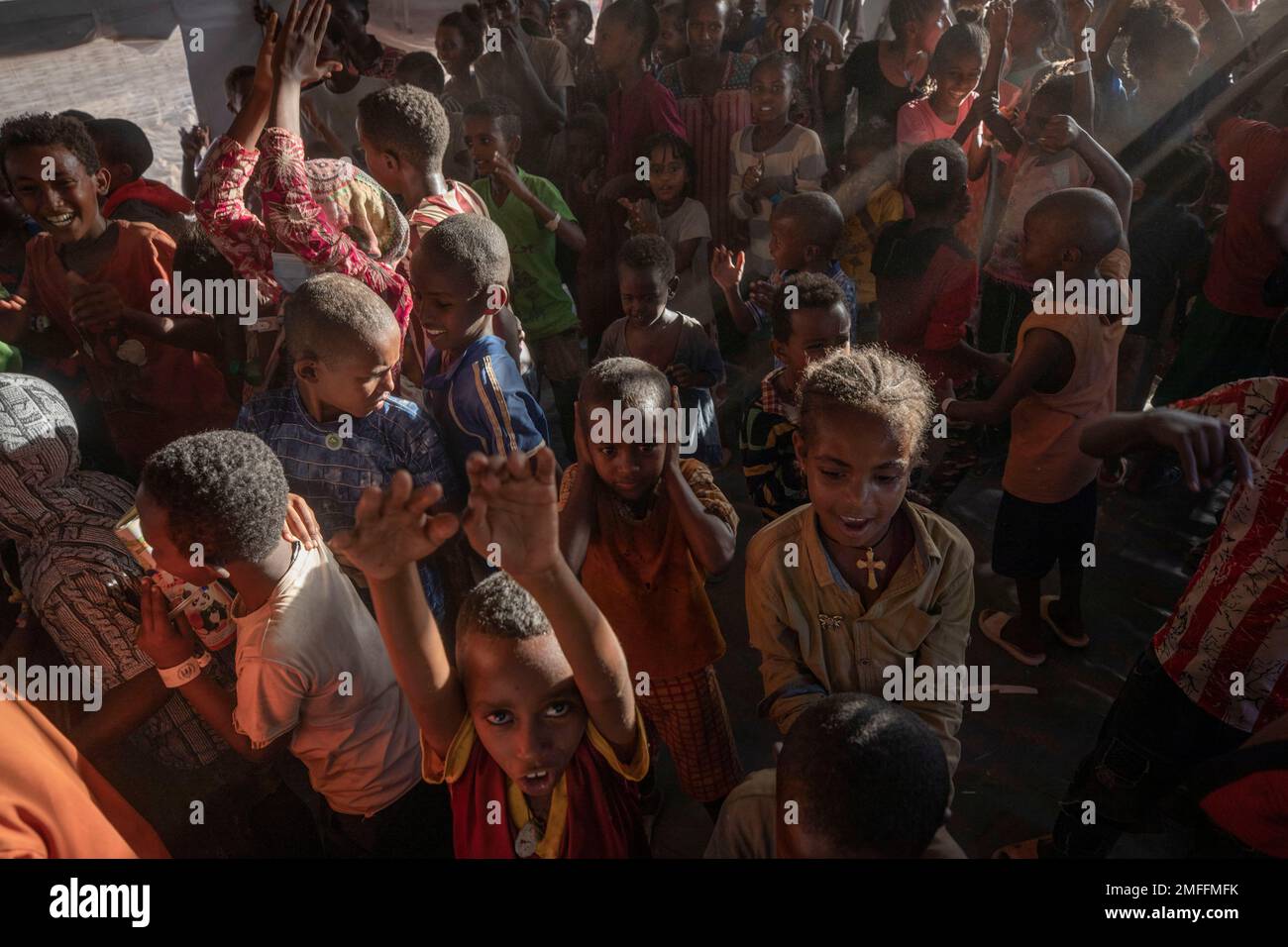 Tigray refugee children sing and dance inside a tent run by UNICEF for ...
