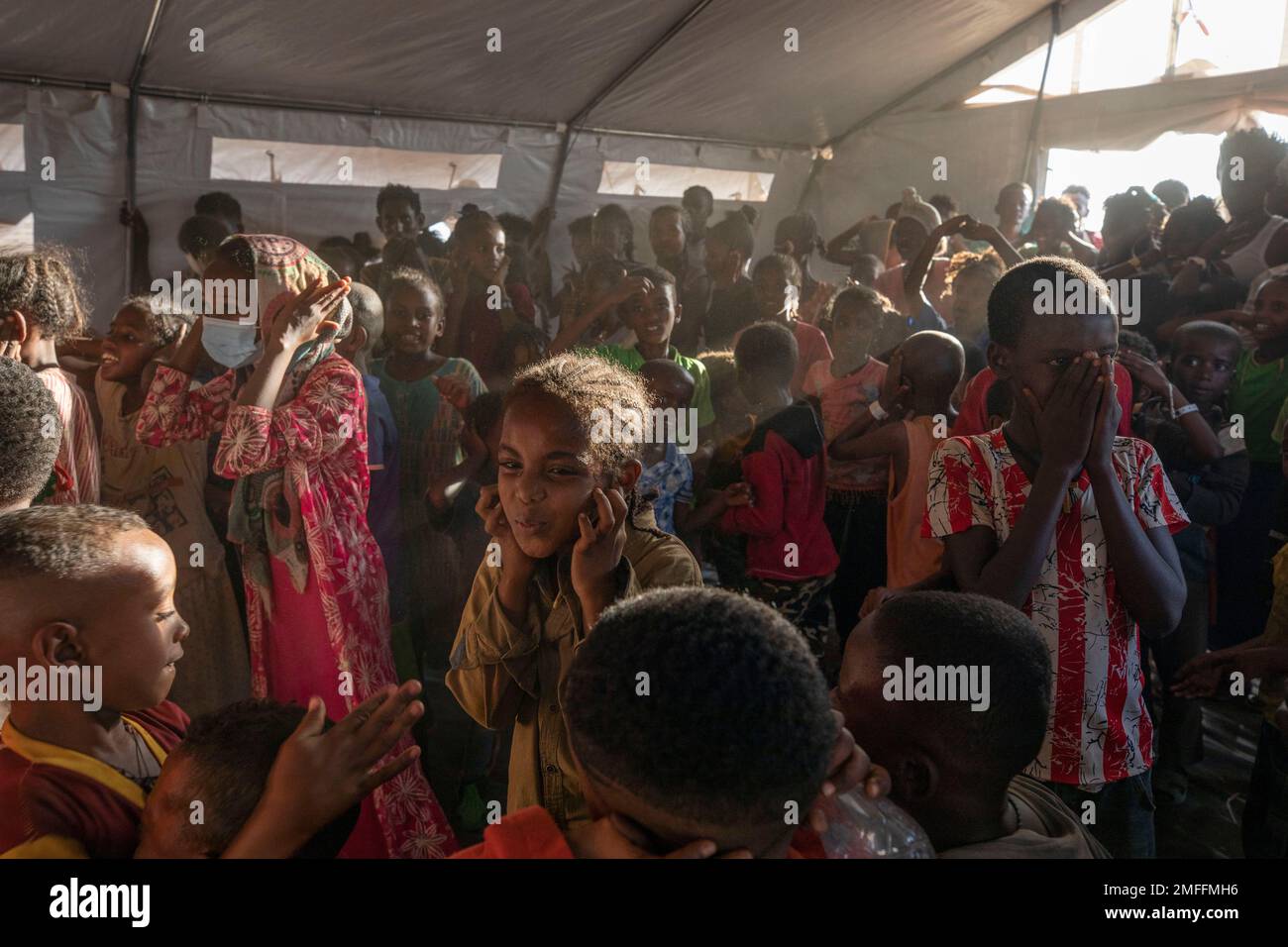 Tigray refugee children sing and dance inside a tent run by UNICEF for ...