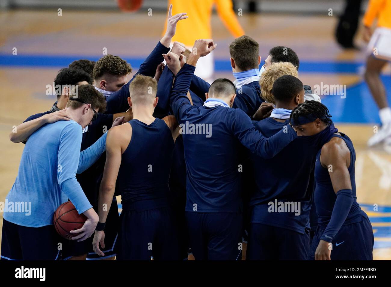 San Diego players huddle before an NCAA college basketball game against ...