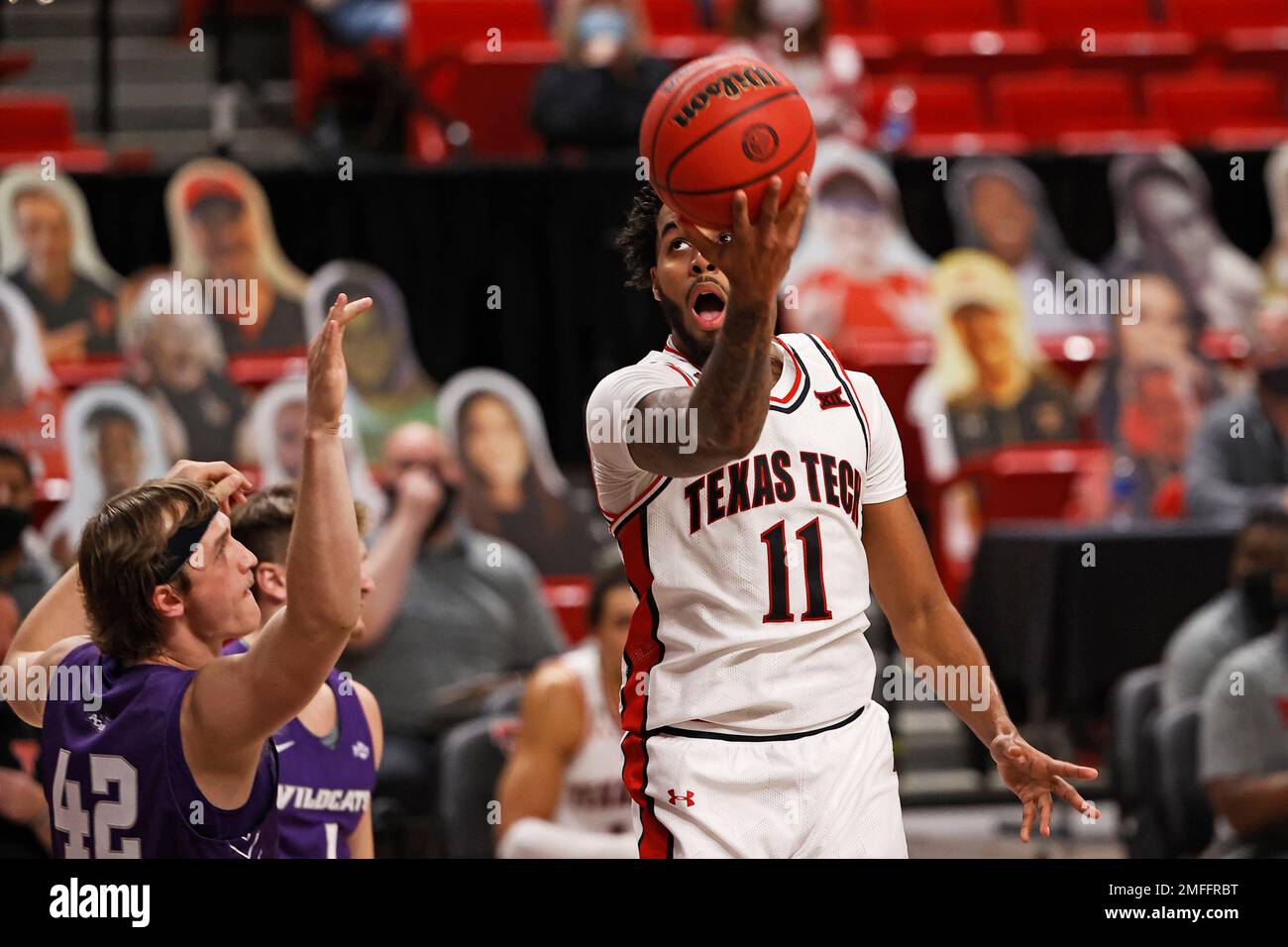 Texas Tech's Kyler Edwards (11) lays up the ball during the second half ...