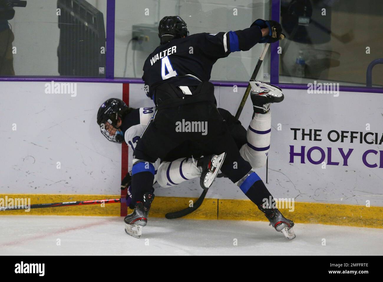 Bentley's Marcus Walter (4) upends Holy Cross's Grayson Constable (13 ...