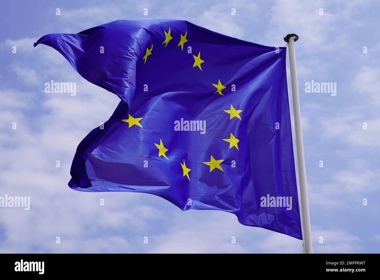 European Union EU Flag yellow stars Waving in mat on cloud blue sky ...