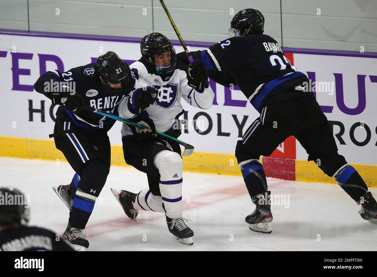 Holy Cross's Grayson Constable (13) is defended by Bentley's Cole Kodsi ...