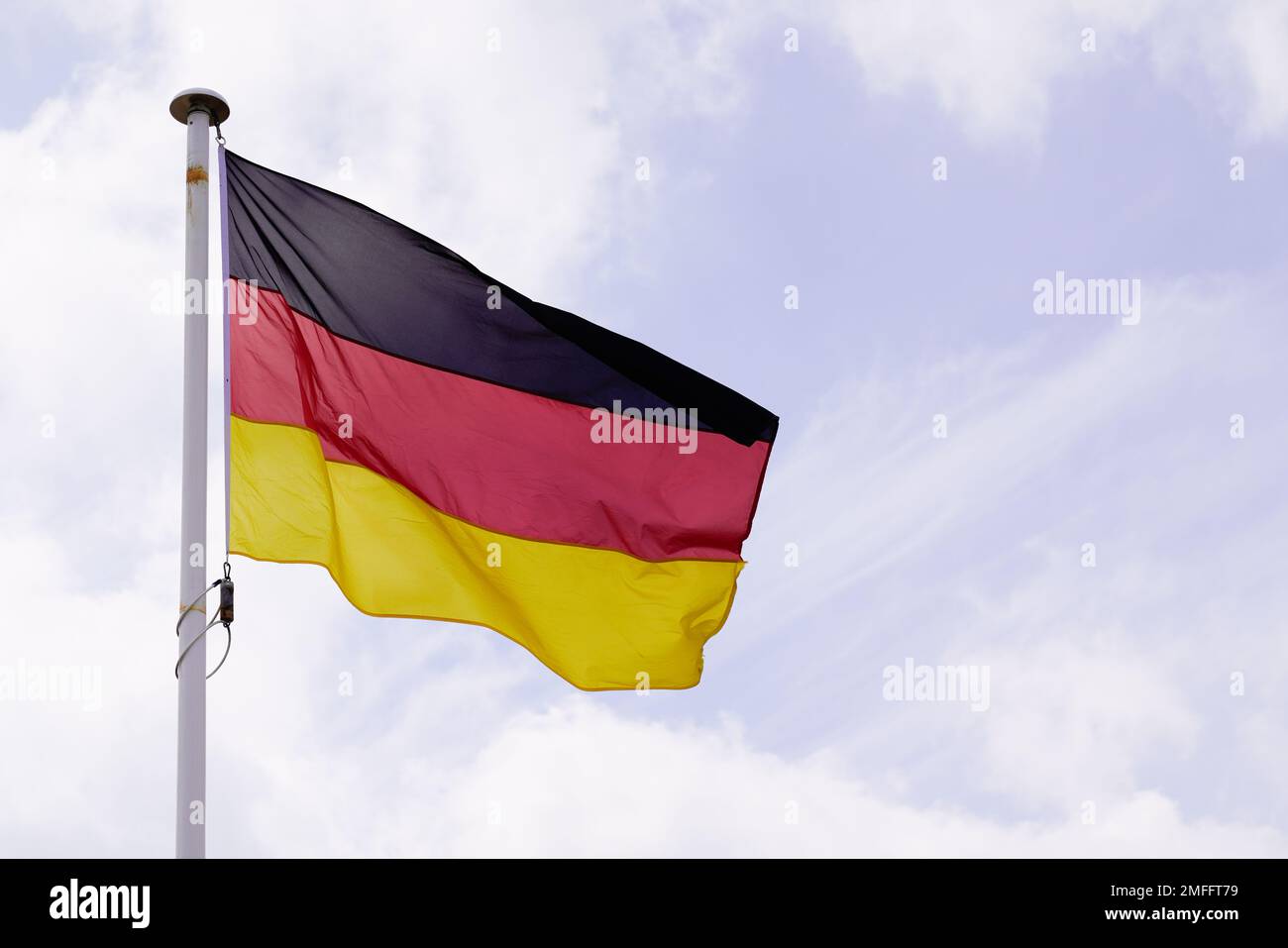 flag german in germany state flag on wind mat with blue cloud sky Stock ...