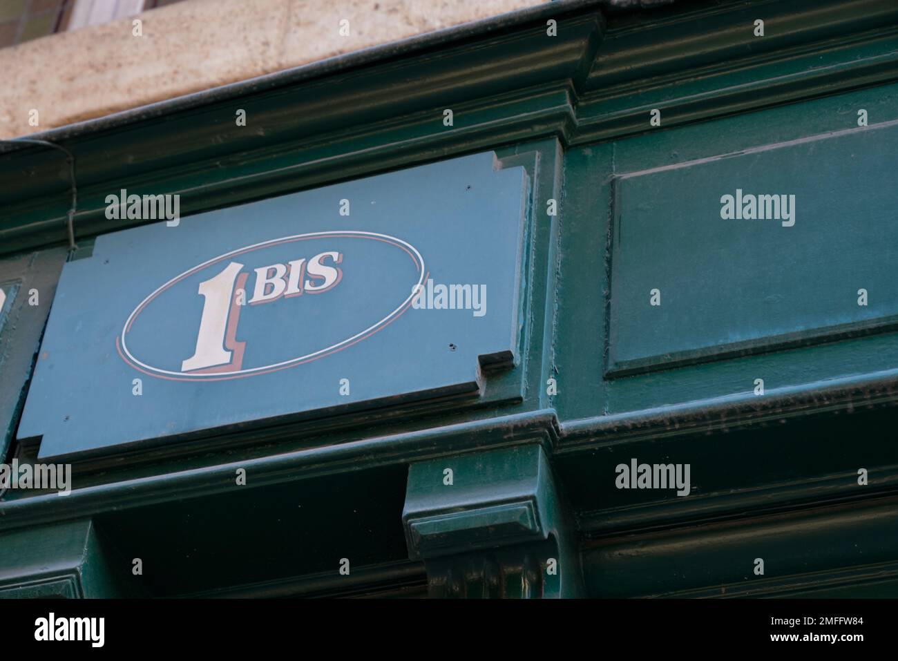 House number home facade in street 1 bis One Figure on Door green Stock ...