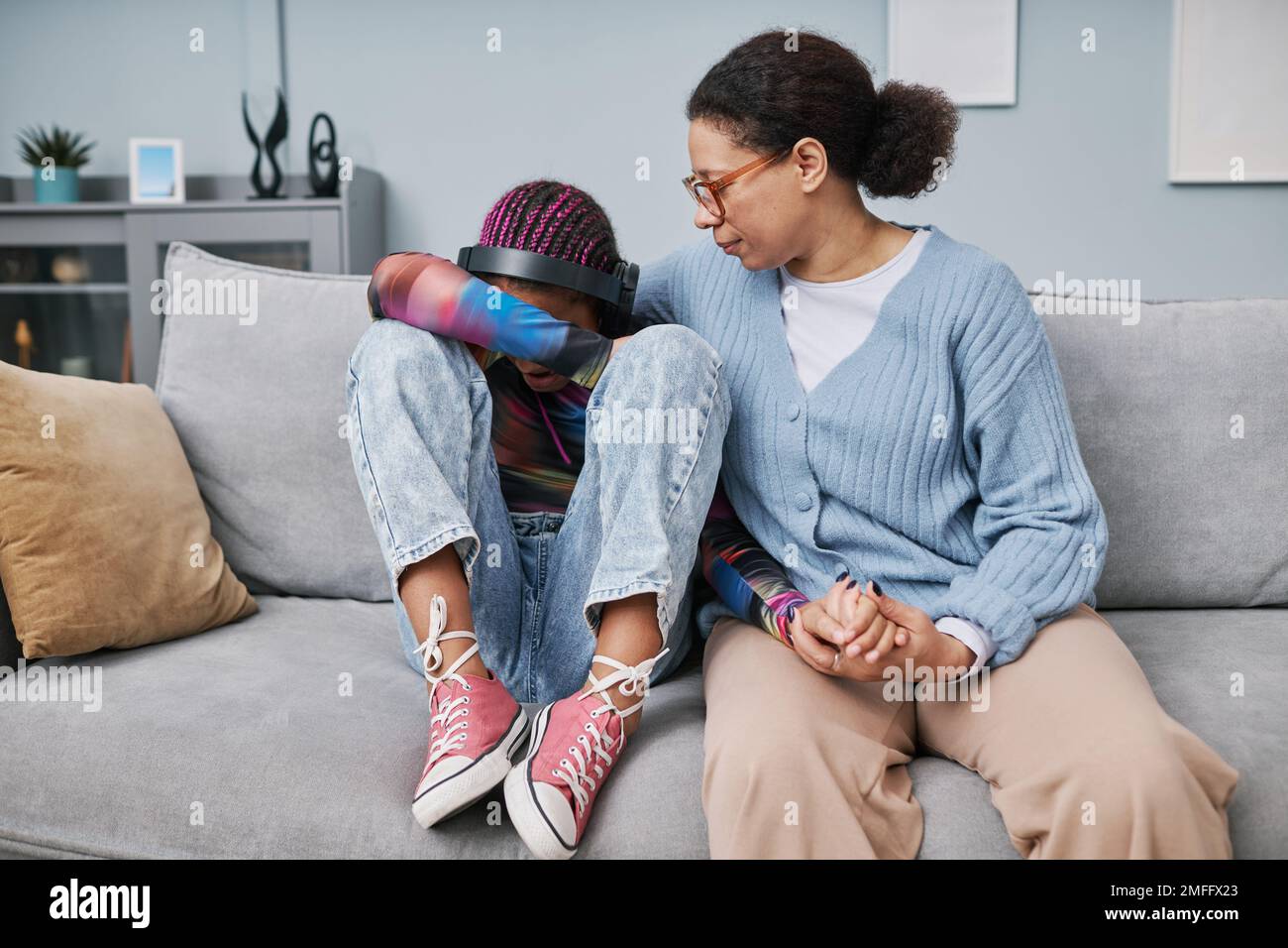 Teenage daughter comforting her mother hi-res stock photography and images - Alamy