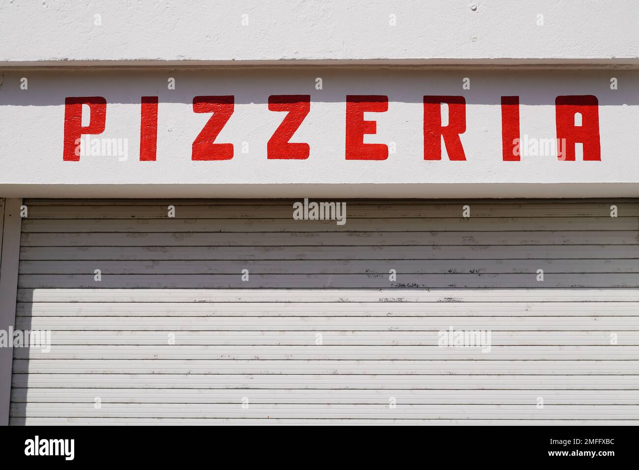 Pizza pizzeria restaurant red sign old vintage on street outside view ...