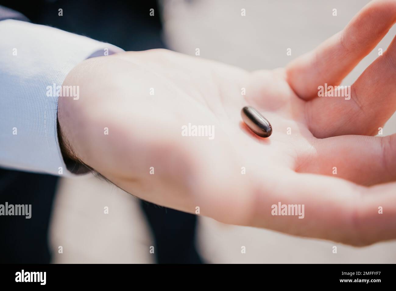 Doctor takes yellow medical pills hi-res stock photography and images ...