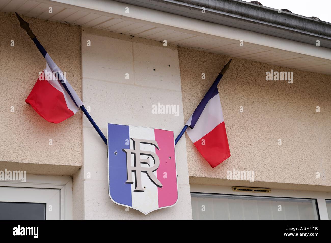 city hall facade with RF french flag on town hall entrance in village ...