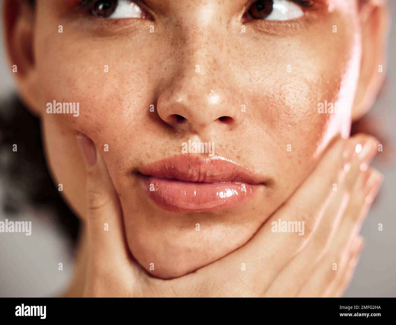 Face, freckles and woman with real skin care, thinking and makeup ...