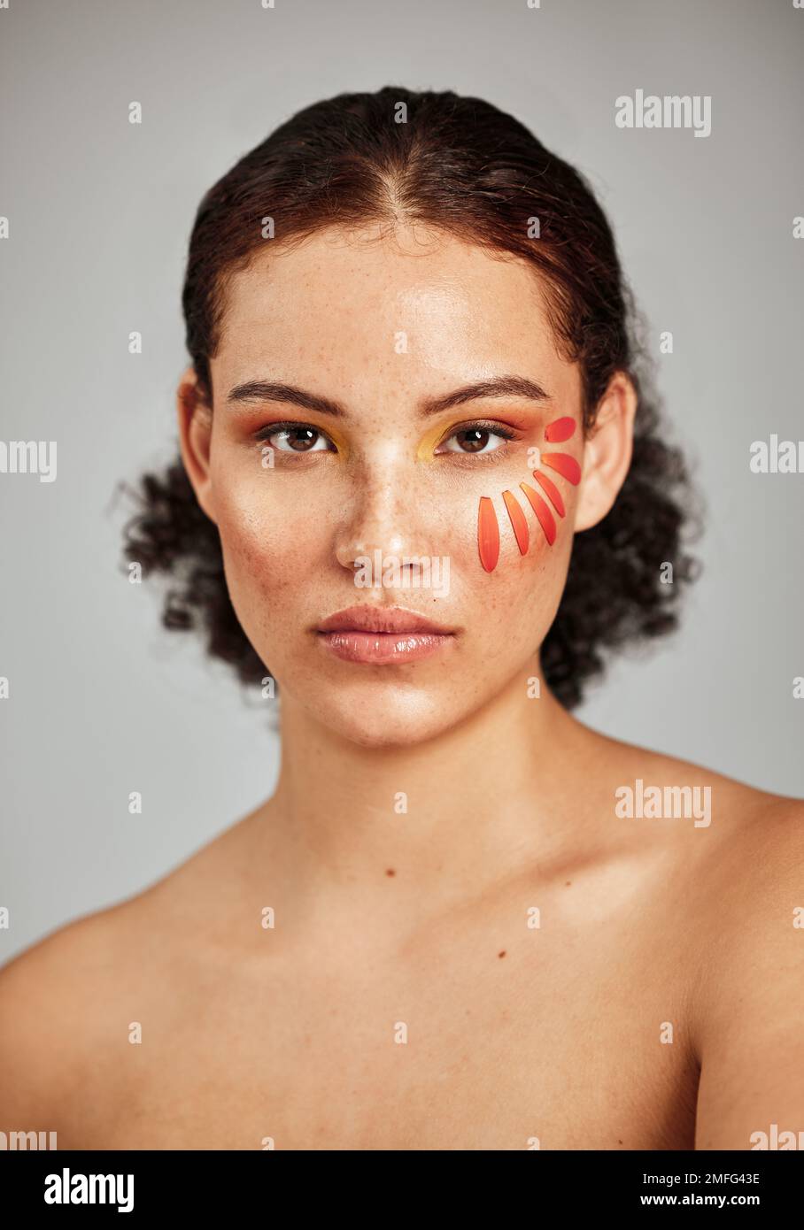 Flower petal, beauty and makeup portrait of a woman in studio for ...