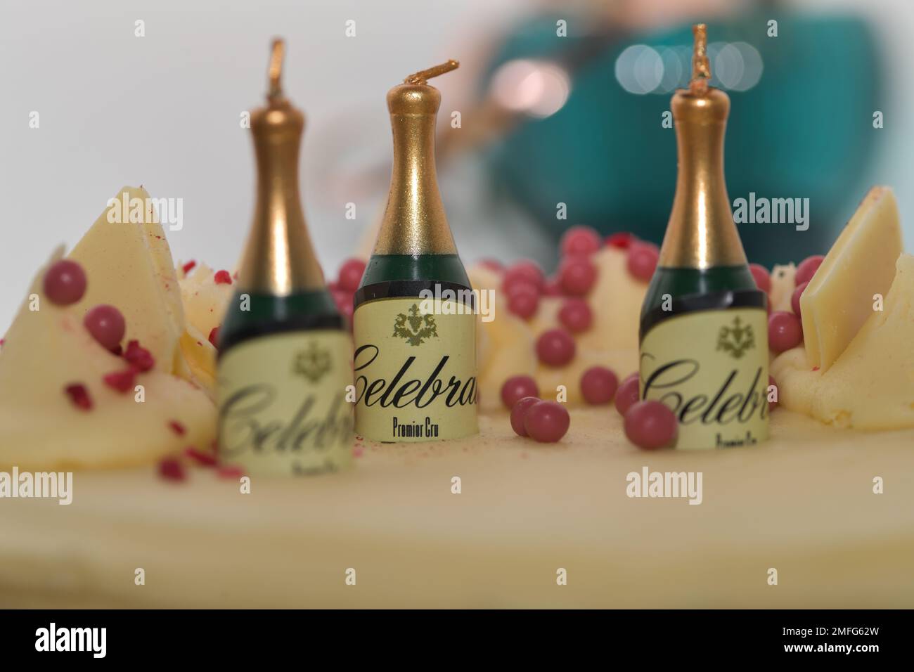 Champagne shaped birthday candles sitting on top of a Birthday Cake ...
