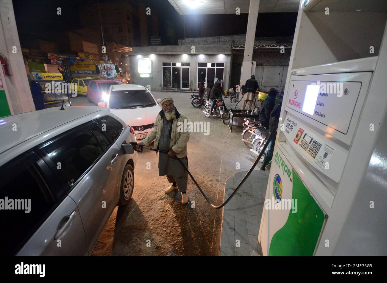 People wait for their turn to get fuel at a petrol station, a day after a country-wide power ...