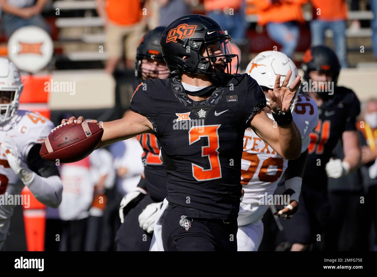 Oklahoma State quarterback Spencer Sanders (3) during an NCAA college ...