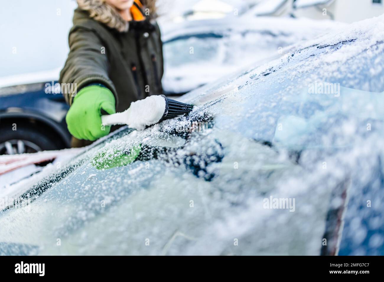 Ice scraping cleans frozen windshield hi-res stock photography and ...