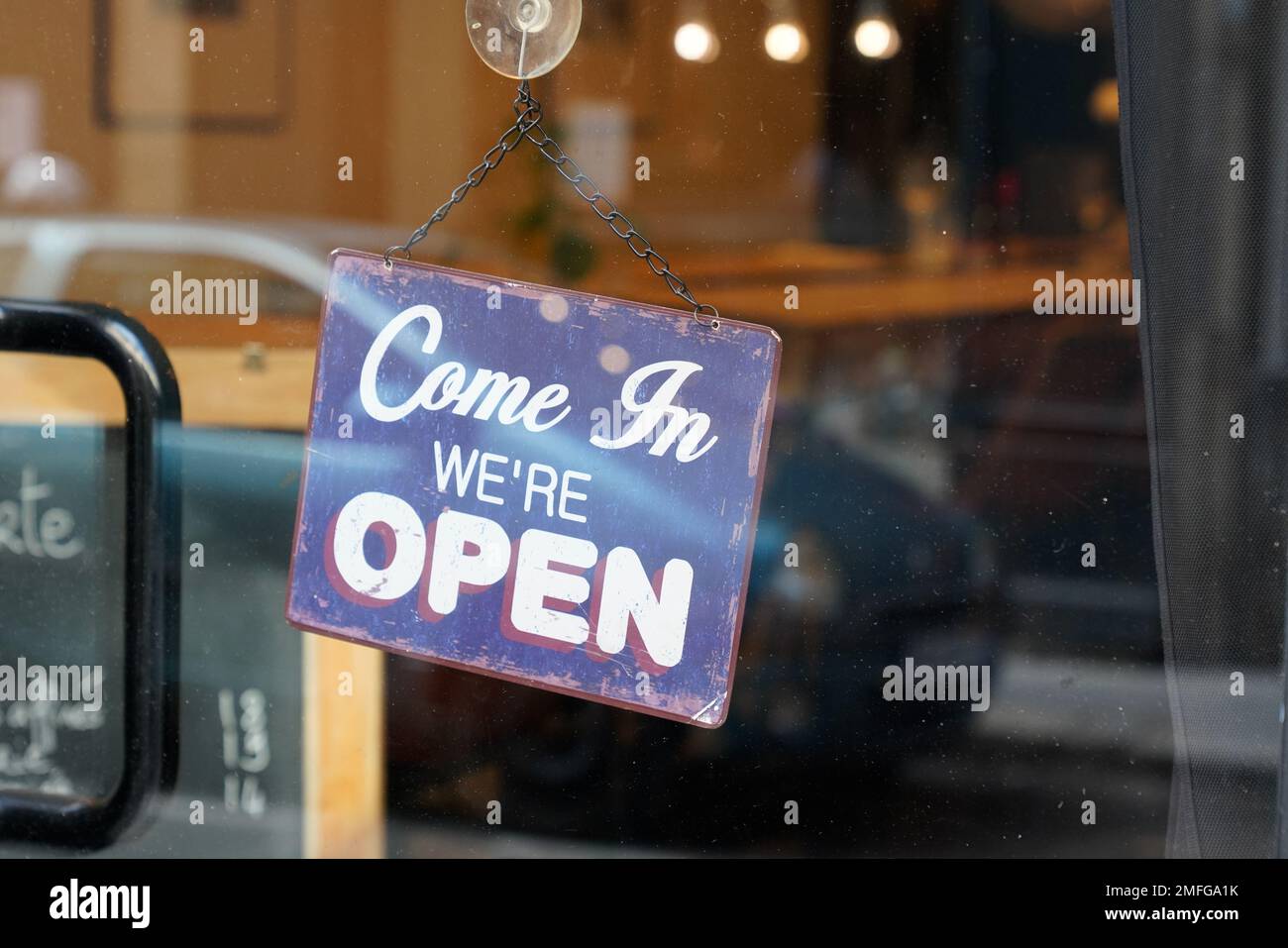 come in open boutique text sign board on windows shop restaurant cafe ...