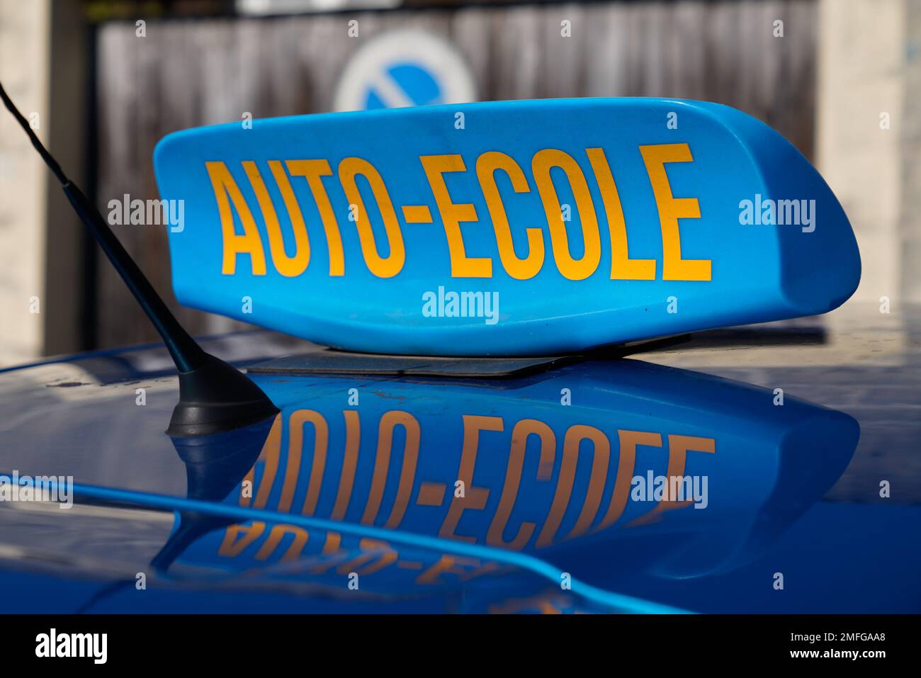 driving school means auto ecole text sign in french write on blue ...
