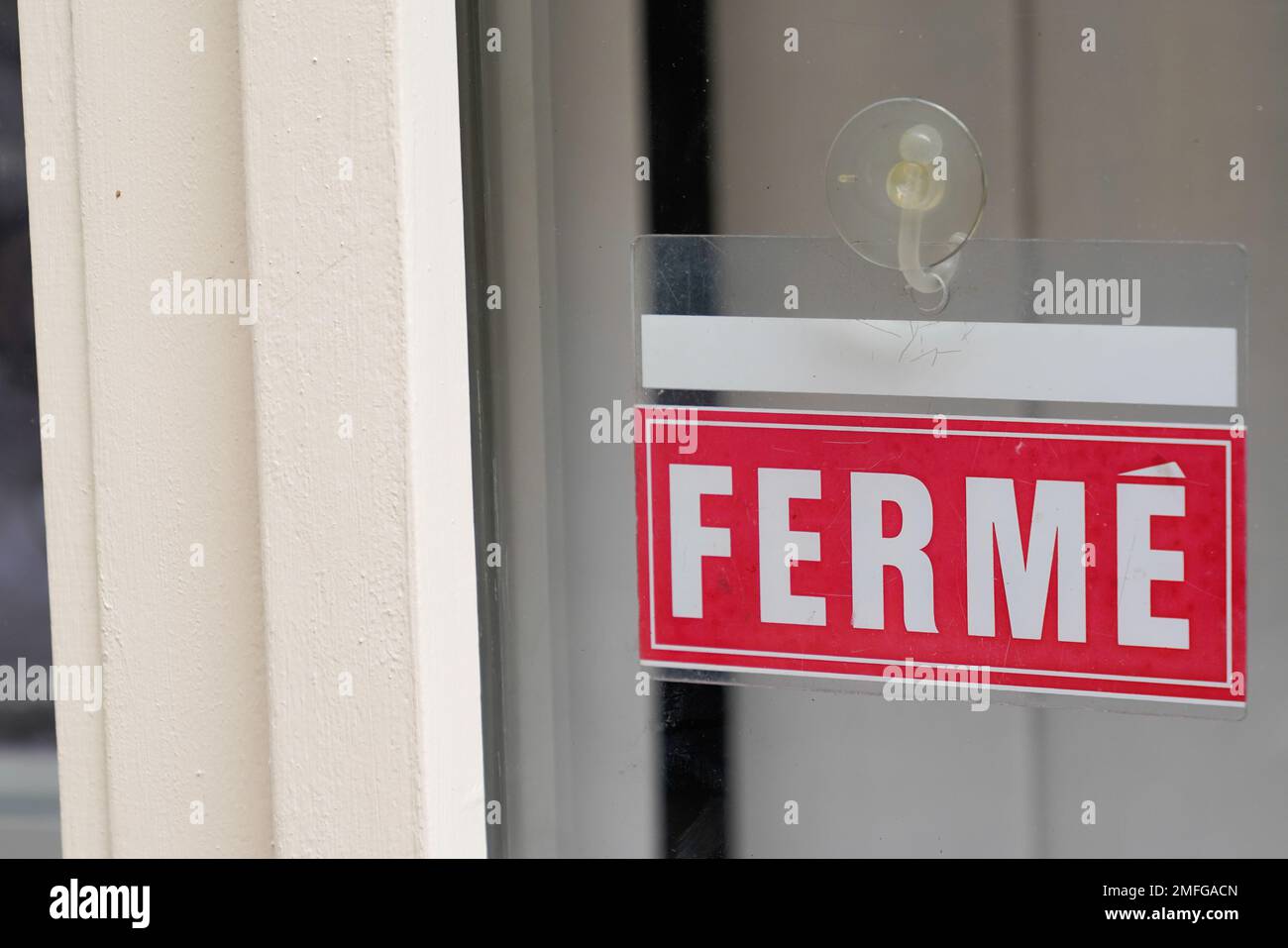 ferme means in french closed on text sign board red on windows shop ...