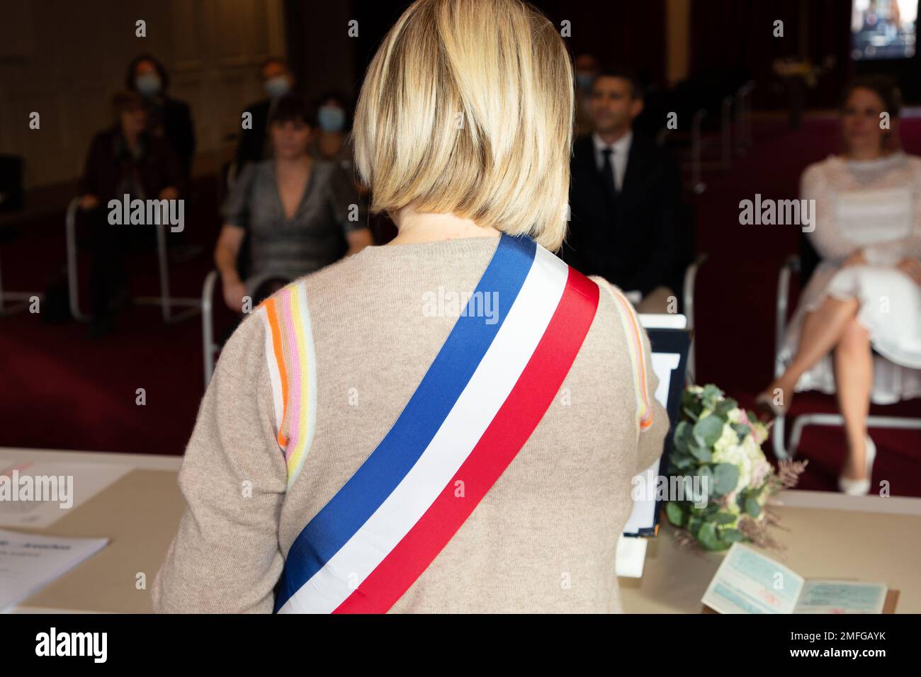 behind view of blonde woman french mayor during an official wedding ...