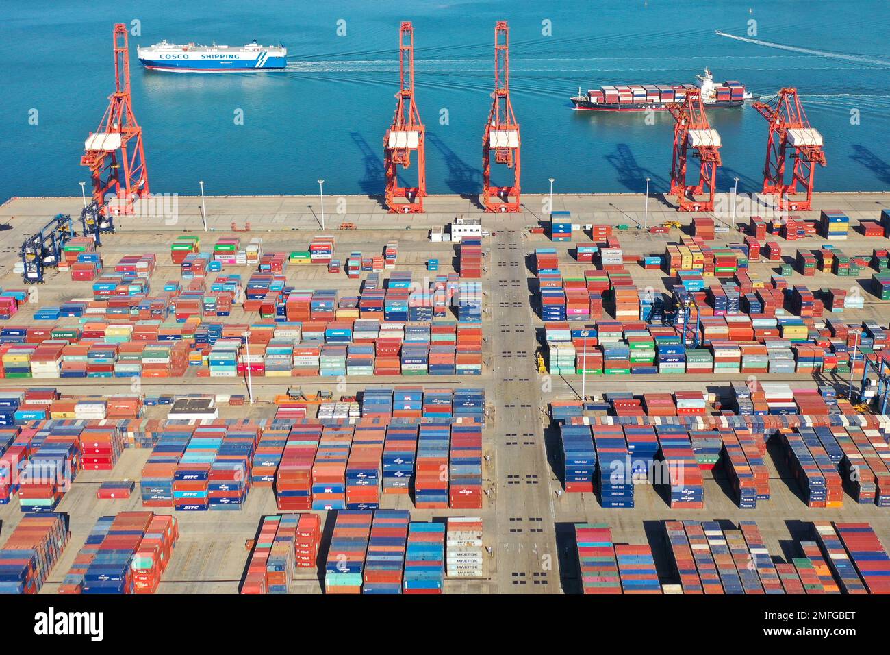 LIANYUNGANG, CHINA - JANUARY 25, 2023 - Cargo ships sail in the sea ...