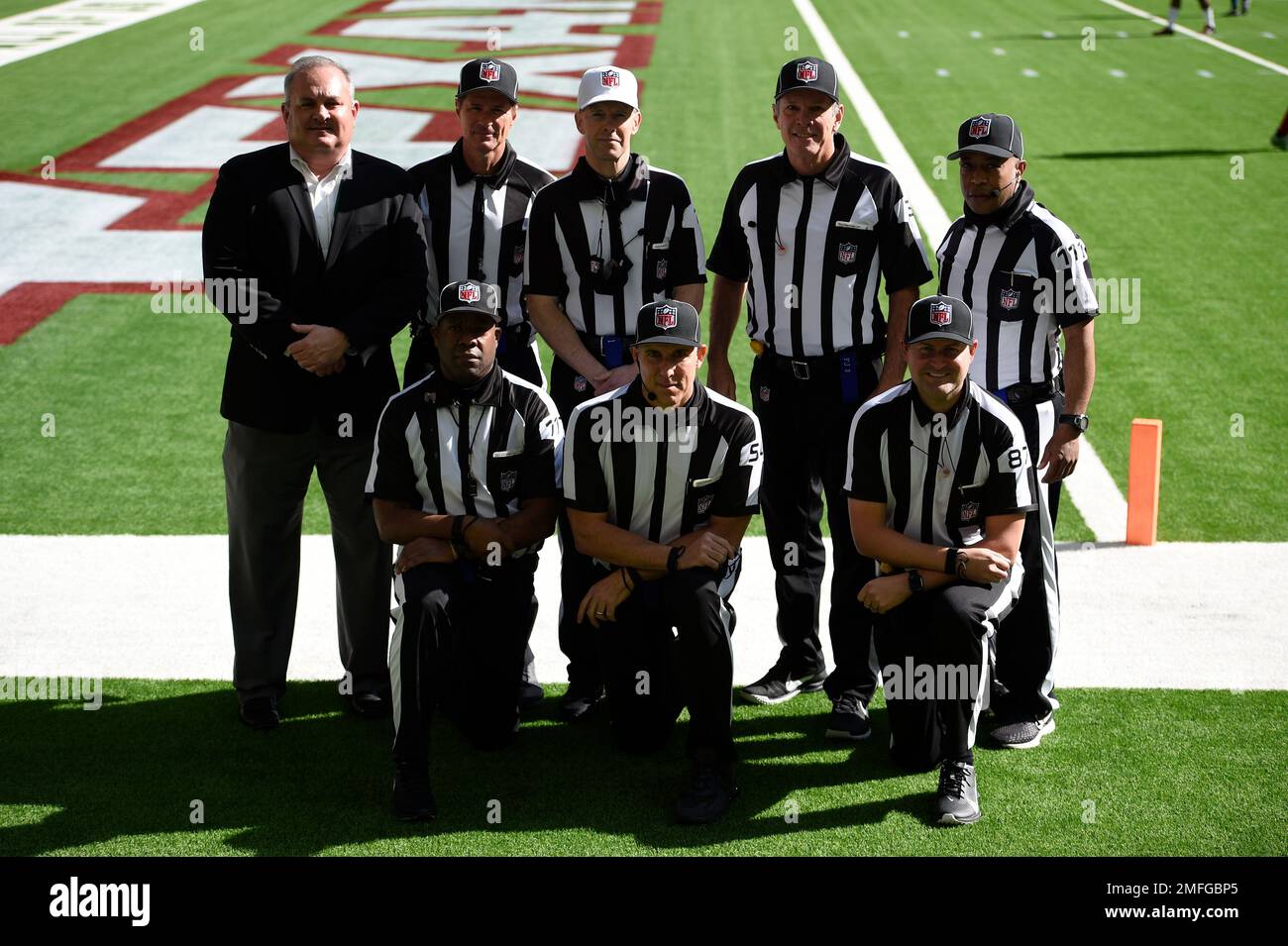 NFL officials pose for a photo before an NFL football game between the ...