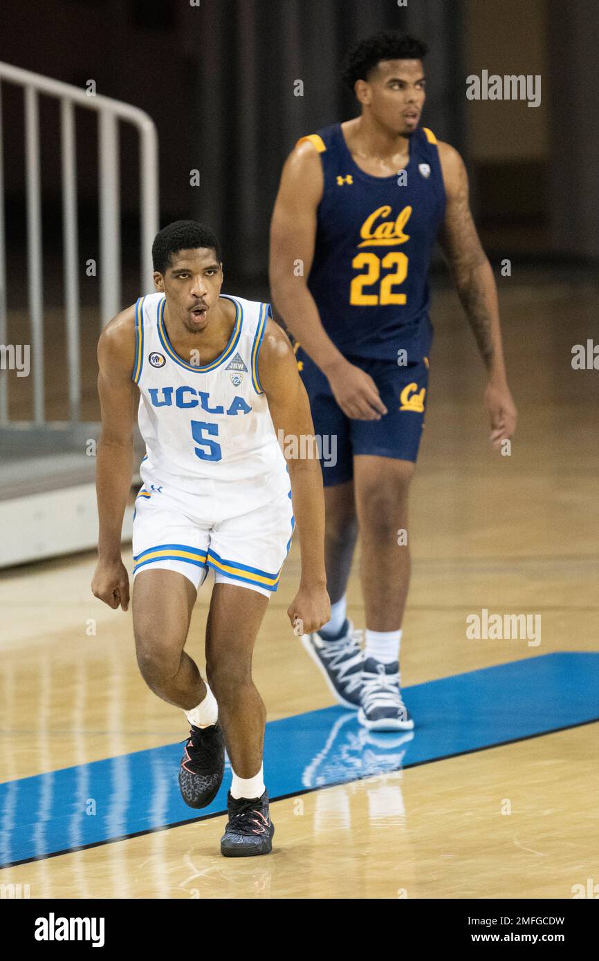 UCLA guard Chris Smith, left, celebrates his thee-point basket as ...