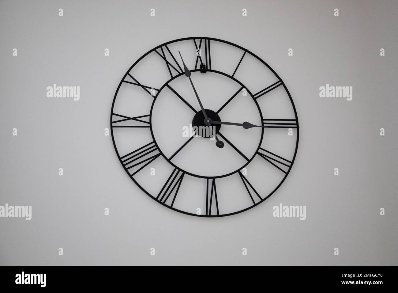 Vintage black steel Old big roman numerals Clock in wall home interior ...