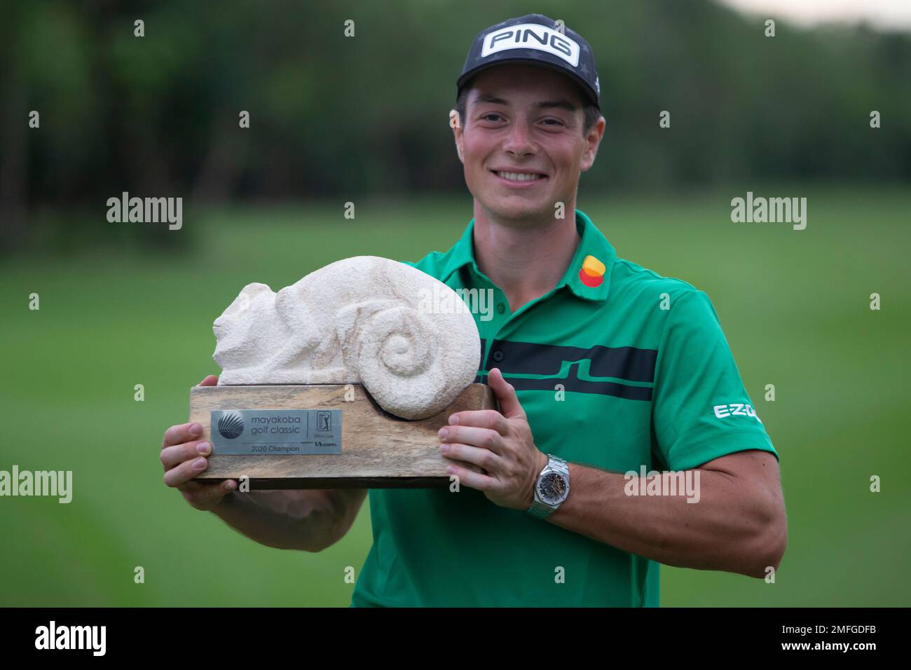 Viktor Hovland of Norway holds up his trophy after winning the PGA Tour ...