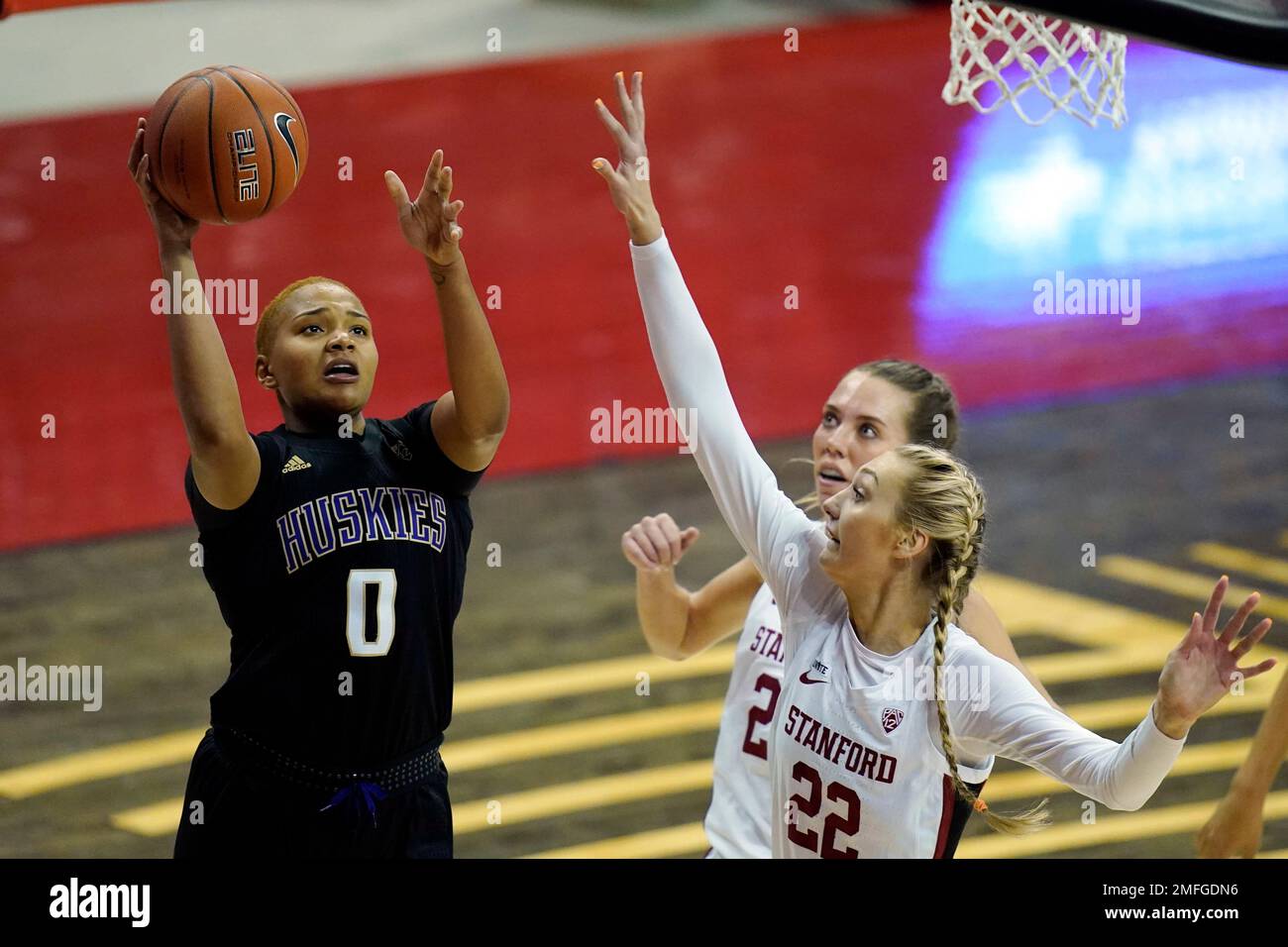 Washington's Quay Miller (0) shoots over Stanford's Cameron Brink (22 ...