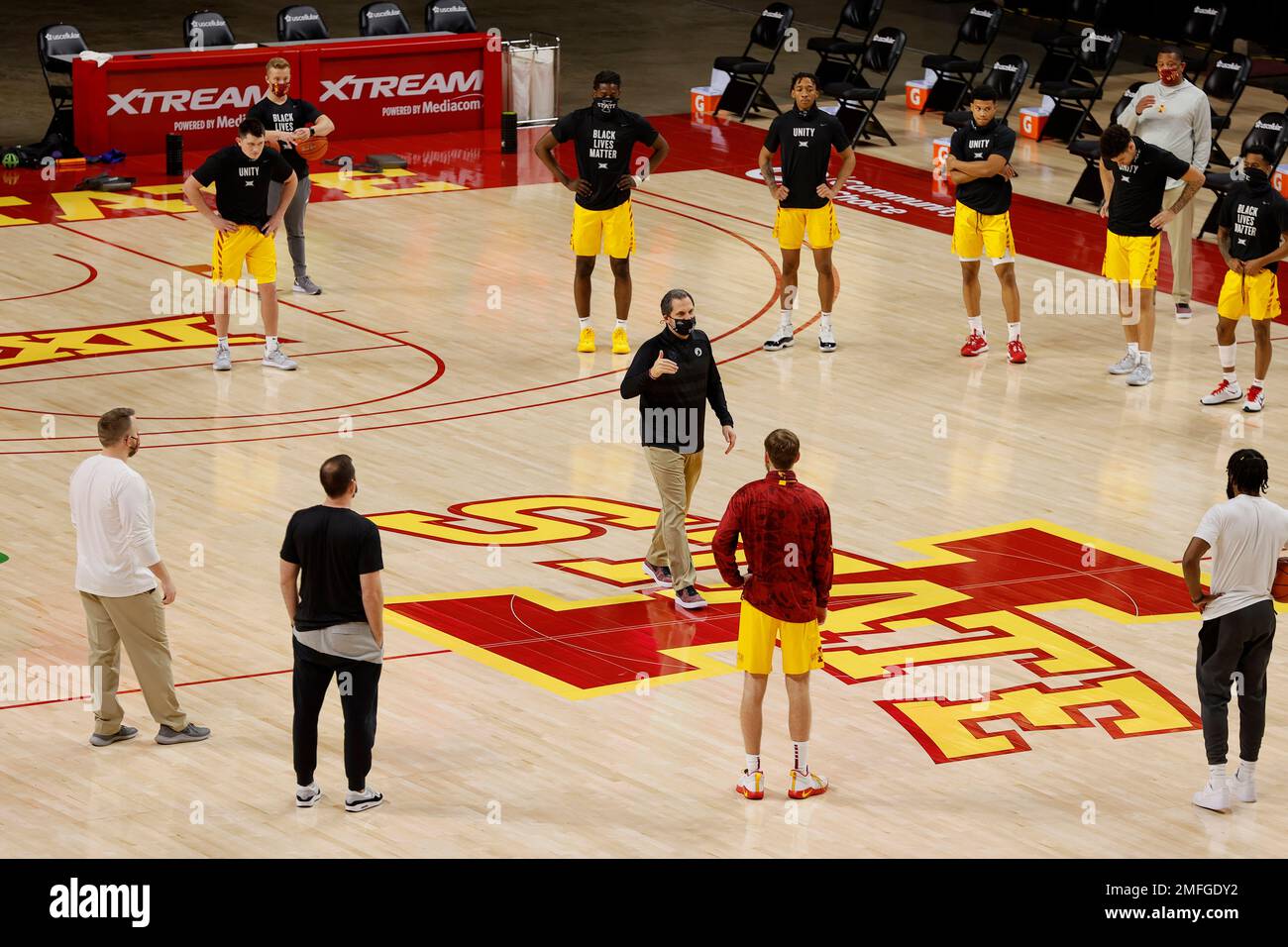Iowa State head coach Steve Prohm, center, informs his team and staff ...