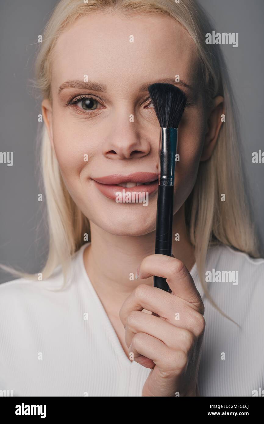 Woman covering one eye hi-res stock photography and images - Alamy