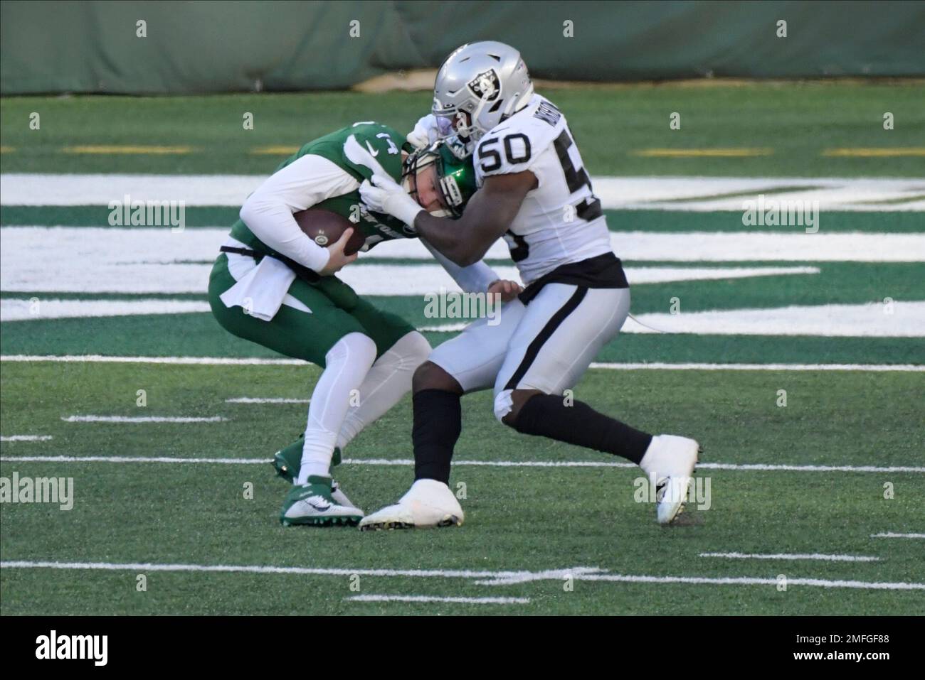 Las Vegas Raiders' Nicholas Morrow, right, sacks New York Jets ...