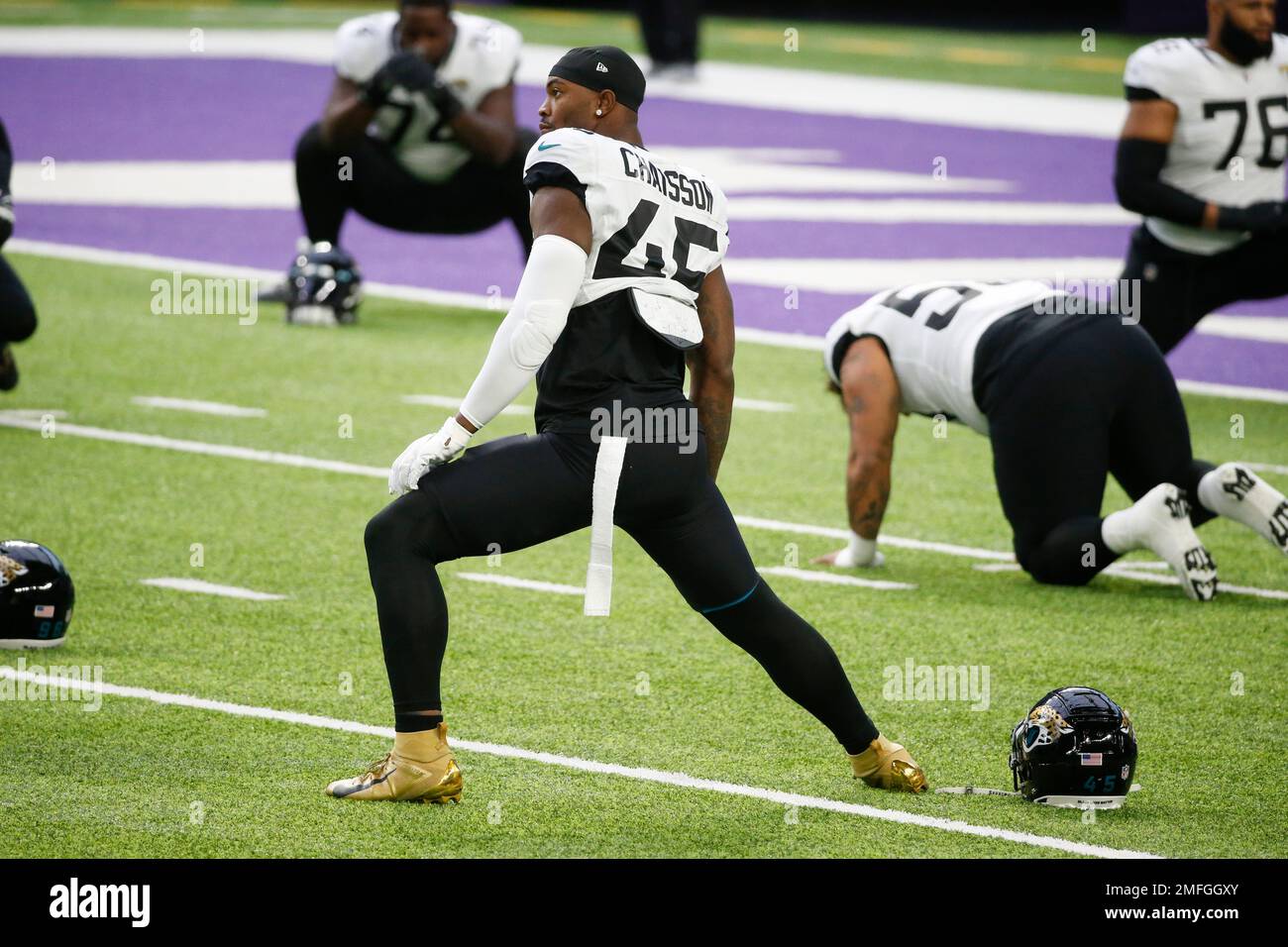 Jacksonville Jaguars linebacker K'Lavon Chaisson warms up before an NFL ...