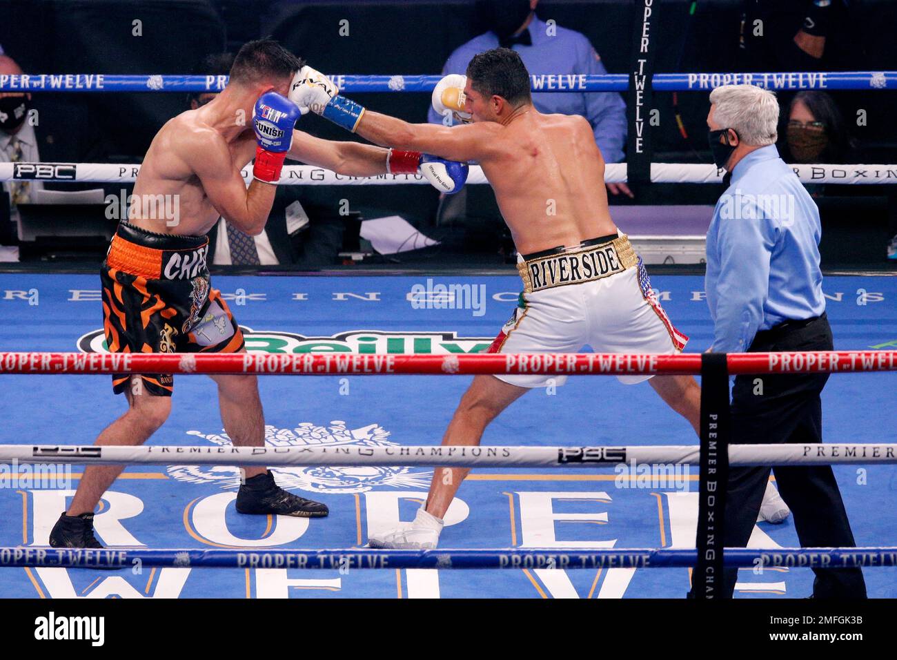 Francisco Santana, left, exchanges punches with Josesito Lopez during a ...